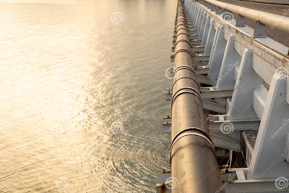 Pipe is Installed Along the Bridge on the Pipe Support Stock Image ...