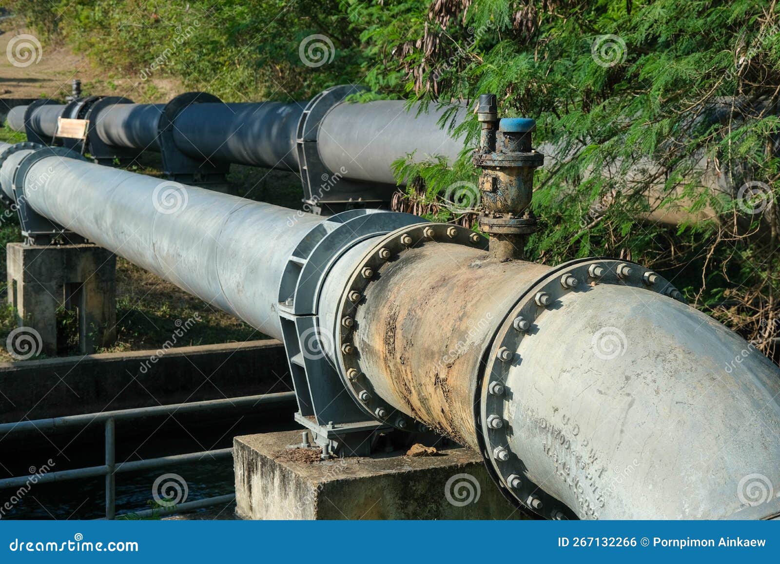 Pipe is Installed Along the Bridge on the Pipe Support. Water Steel ...