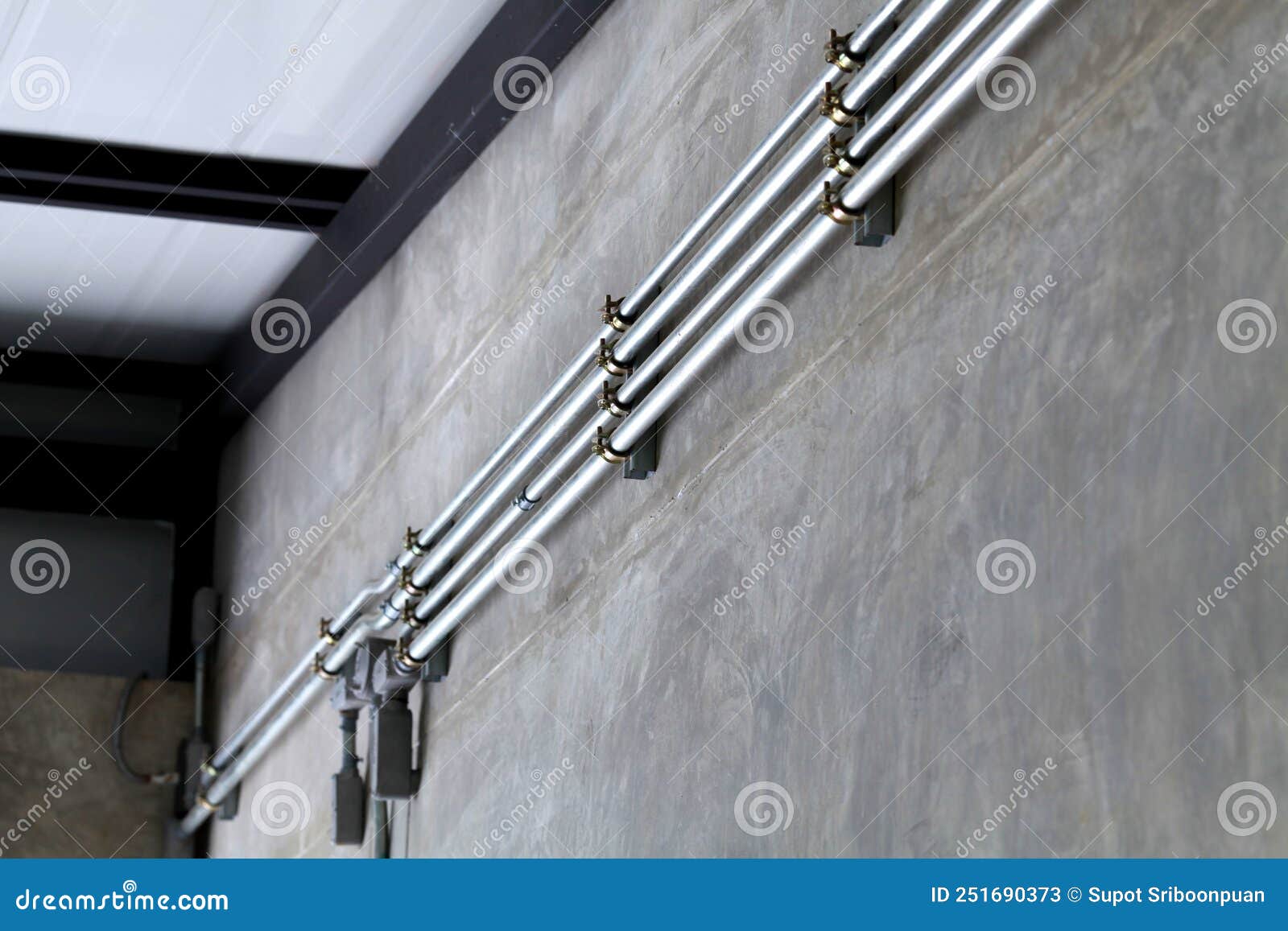 Pipeline on the wall stock image. Image of transfer - 251690373