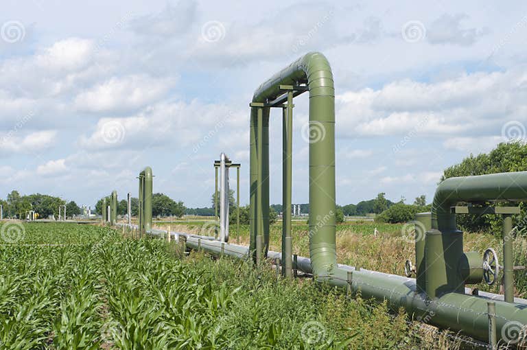 Pipelines through a field stock photo. Image of business - 26848196