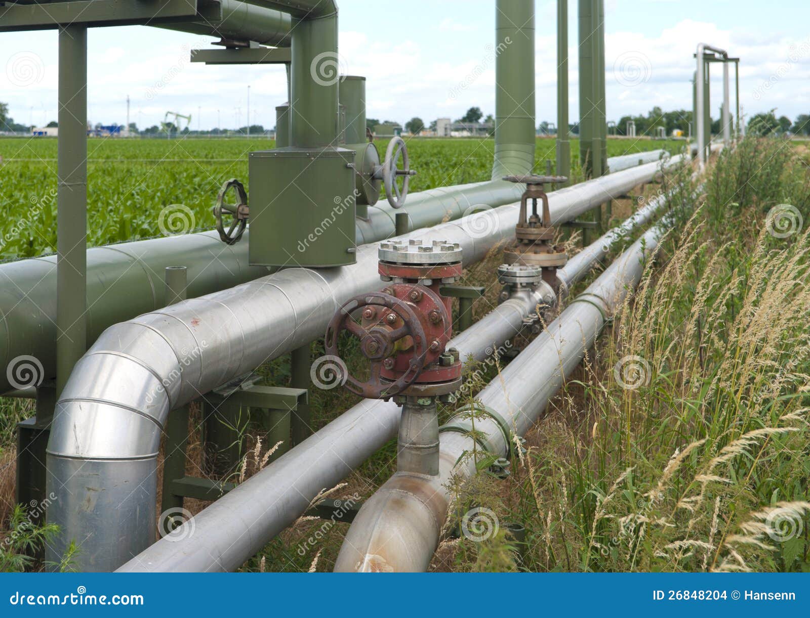 Pipelines through a field stock photo. Image of engineering - 26848204