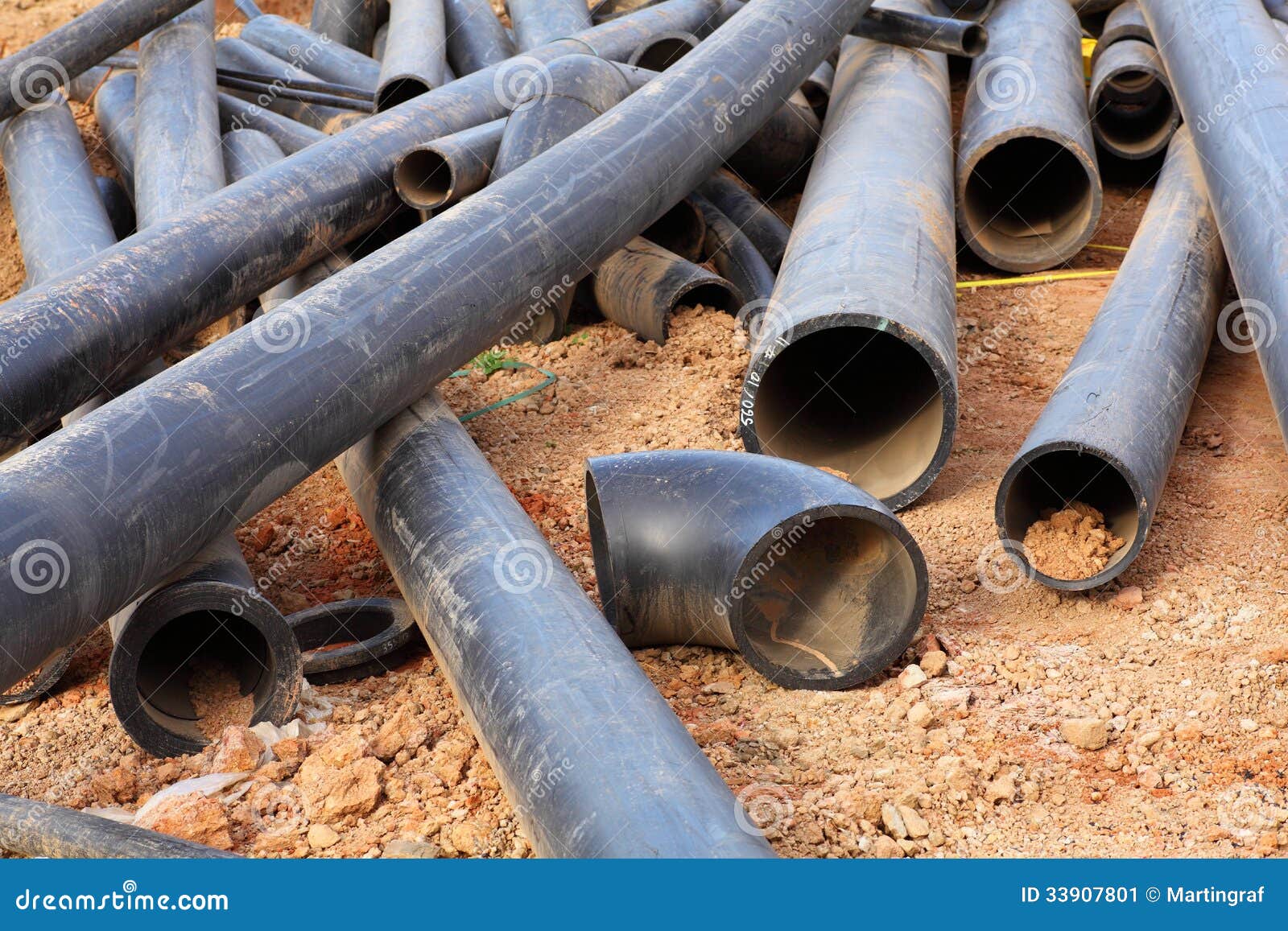 Polymer Pipes Cluttered on Dry Soil Stock Image - Image of messy ...