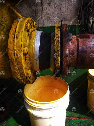 Pipes for Loading and Unloading Dripping Crude Palm Oil Covered in ...