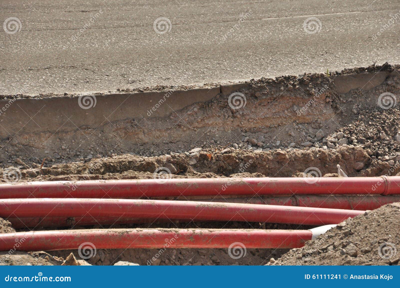 Pipes in sand near road stock image. Image of sand, stoun - 61111241