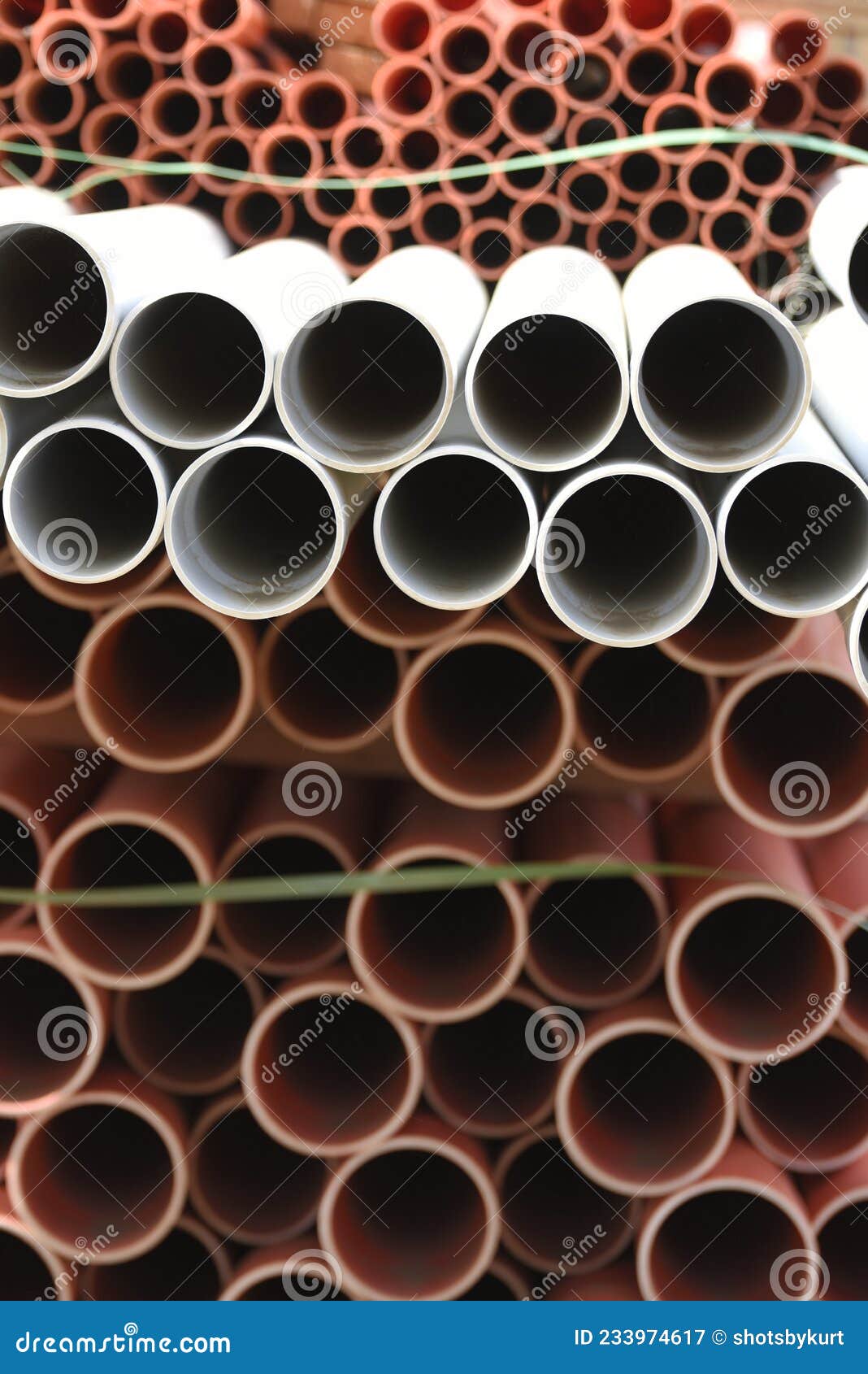 Stack of PVC pipes stock image. Image of construction - 233974617