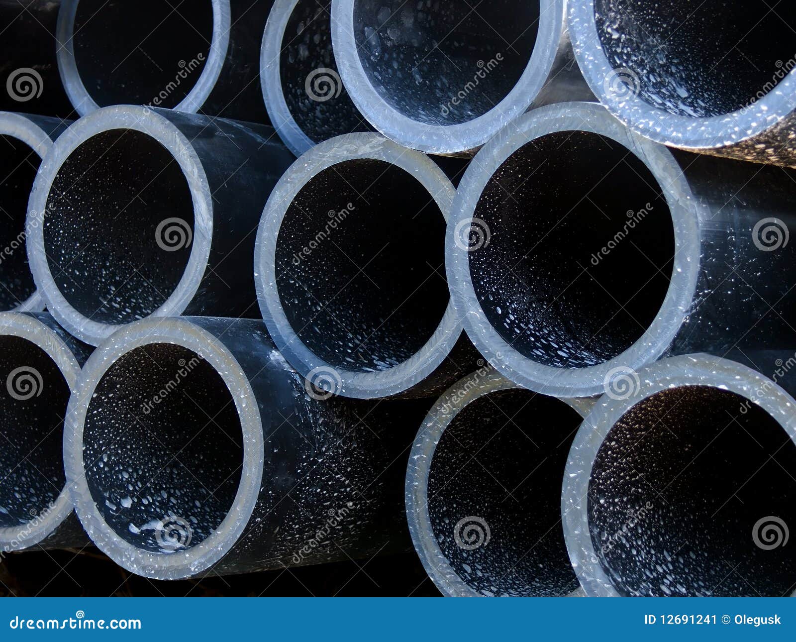 Pipes for water in a stack stock image. Image of round - 12691241