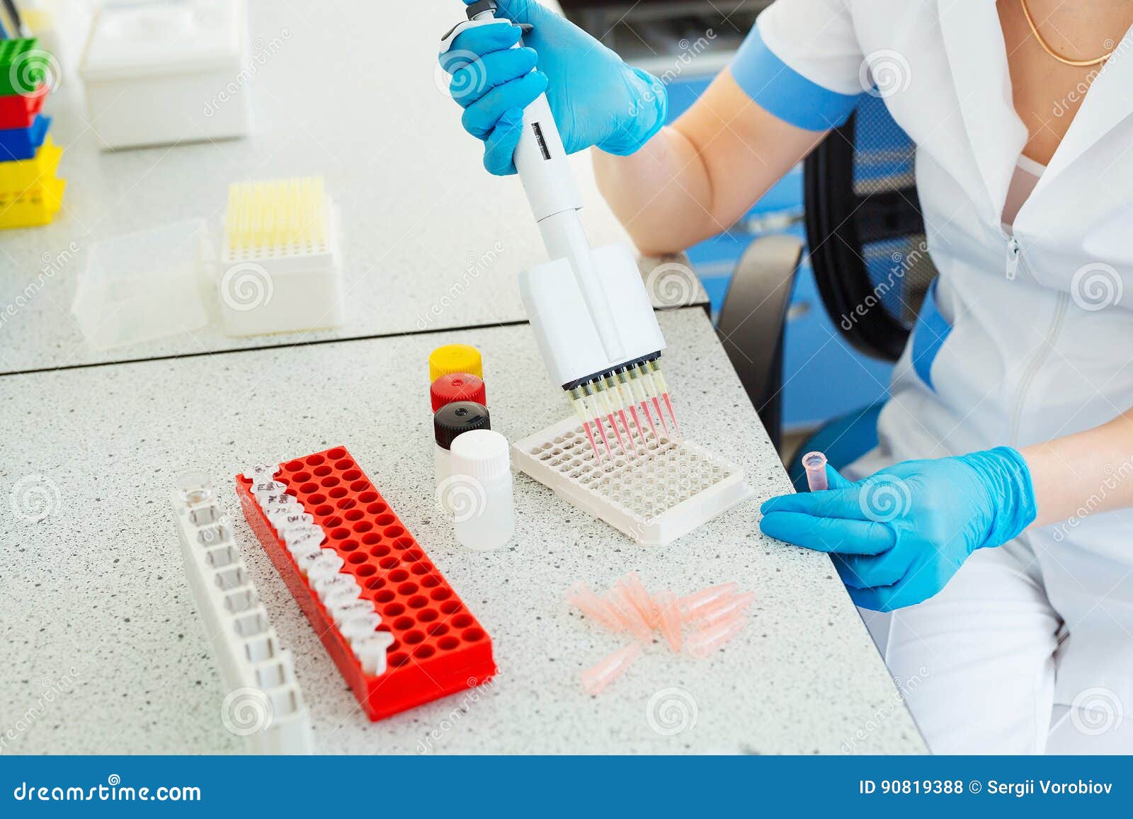 Pipette Dropping a Sample in a Test Tube. Laboratory Assistant ...