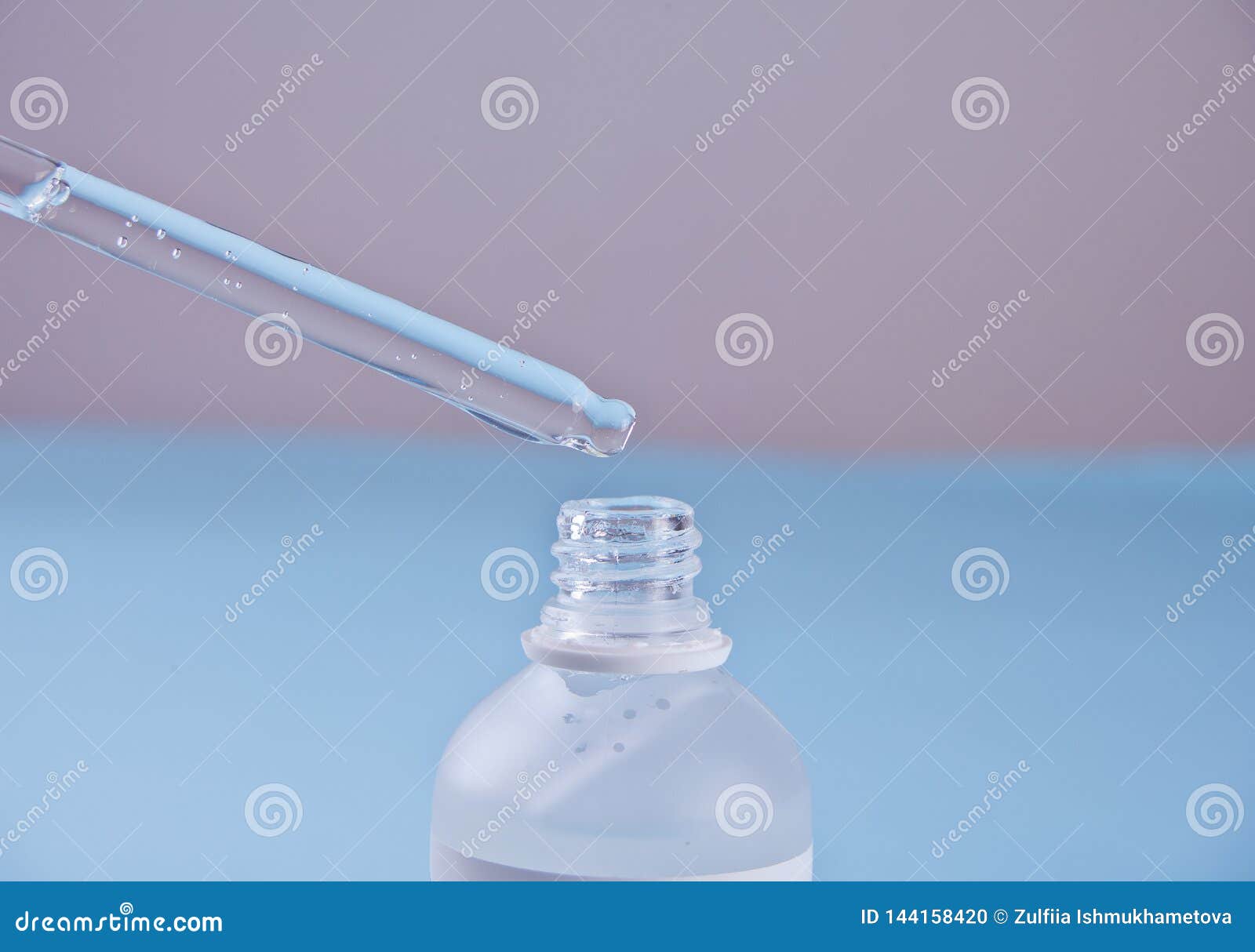 Pipette with Liquid. a Drop of Dripping in a Clear Bottle Stock Photo ...