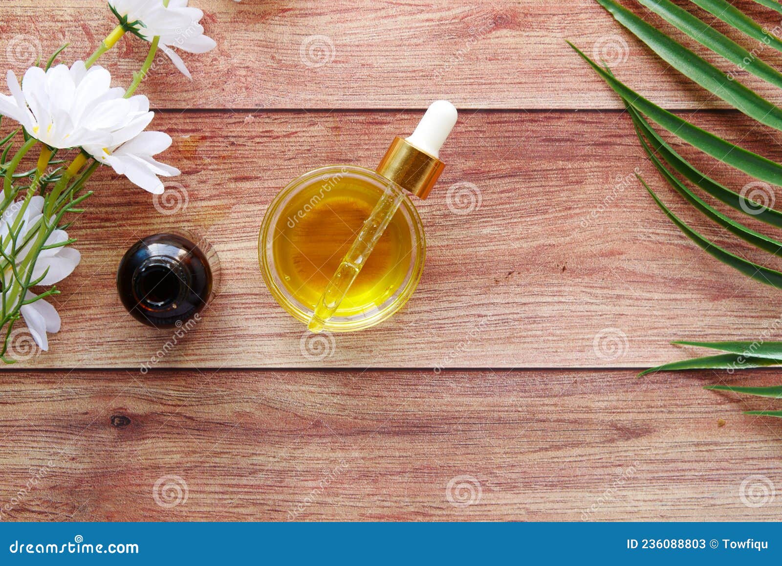 Pipette and Oil in a Small Container on Table Stock Image - Image of ...
