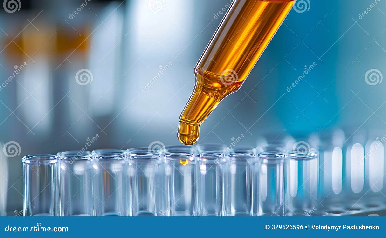 A Pipette Pouring a Liquid into a Test Tube Stock Photo - Image of ...