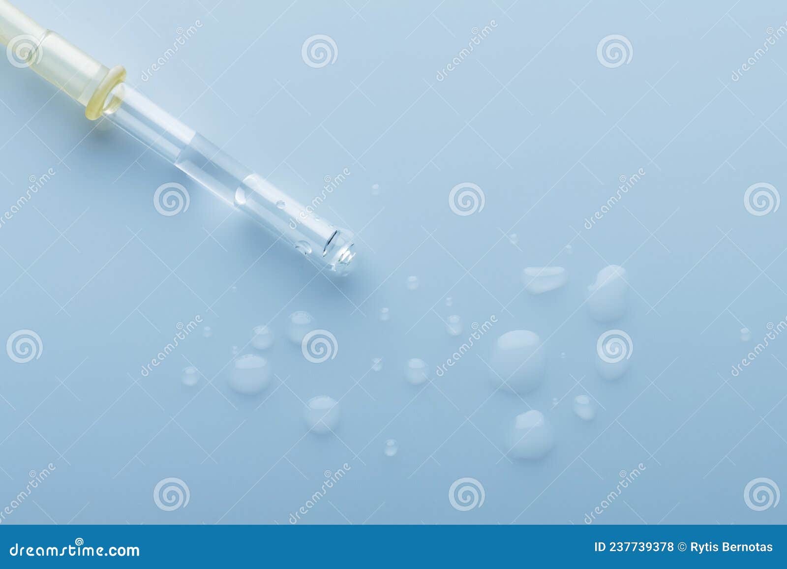 Pipette with Transparent Liquid on Glossy Background Stock Photo ...