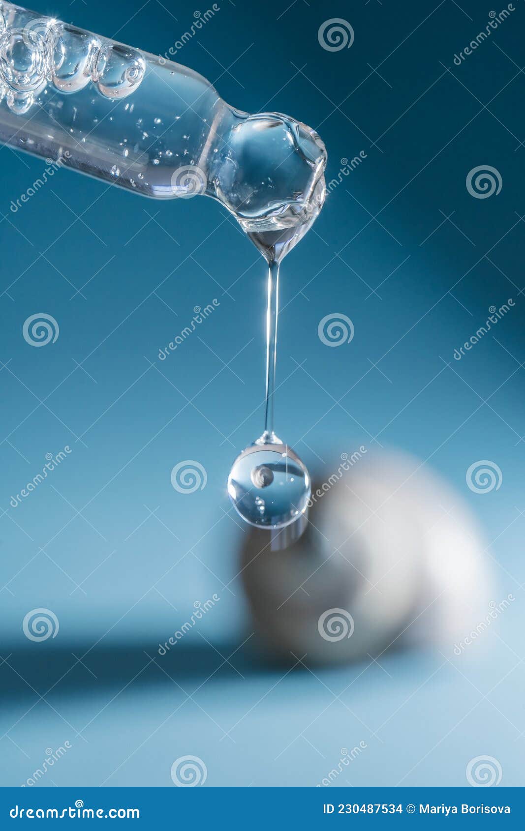 Pipette with Transparent Serum on the Background of Shells. Stock Photo ...