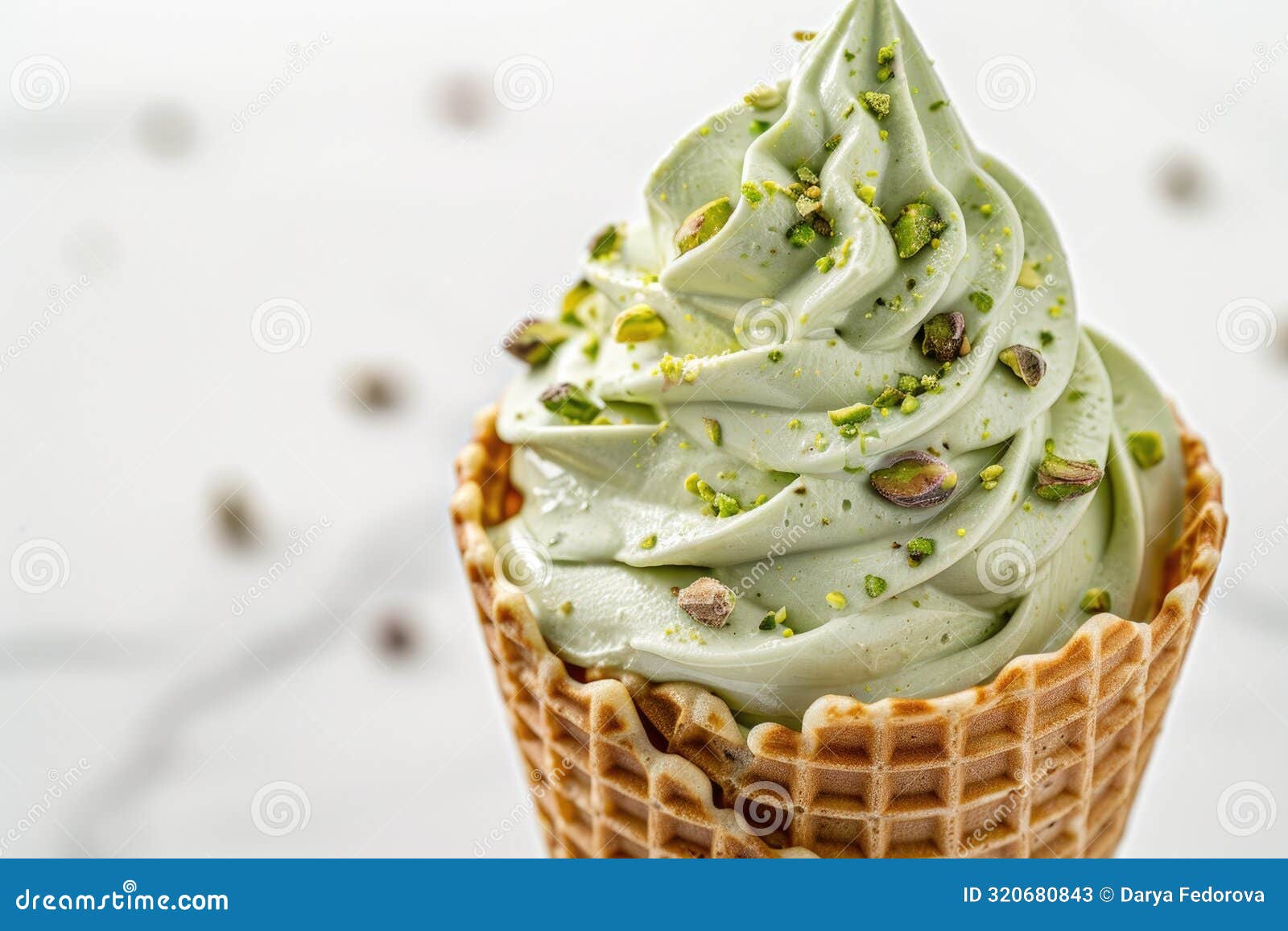 Pistachio Ice Cream Cone with Mint Garnish on Light Background Stock ...