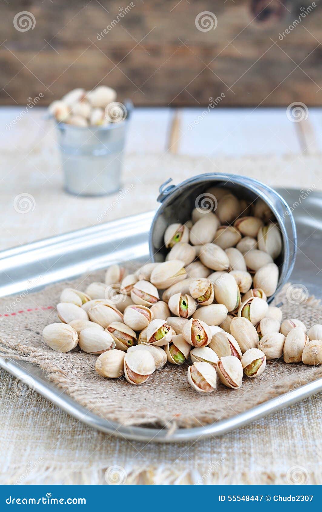 Pistachio nuts in a bucket stock image. Image of appetizing - 55548447