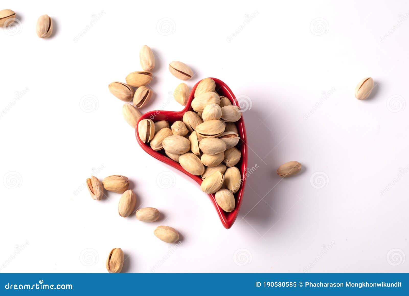 Pistachios, Baked in a Heart Shaped Ceramic Cup on a White Background ...