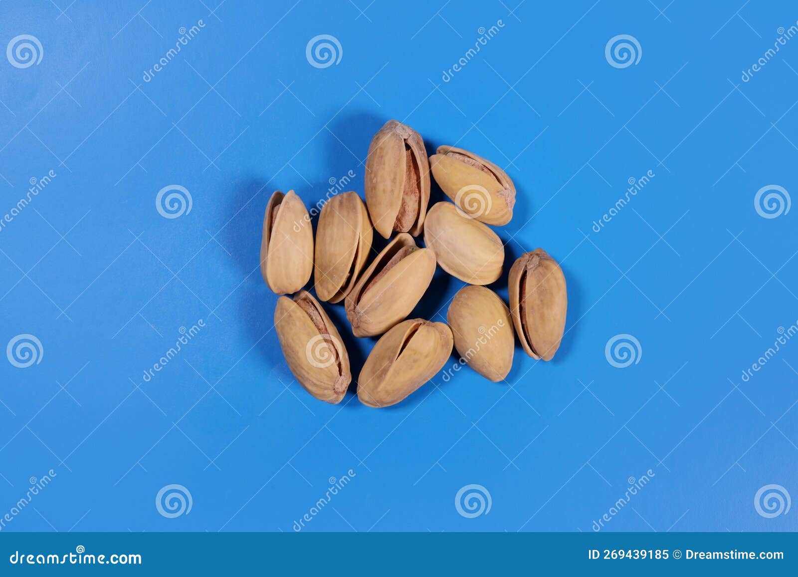 Pistachios in Shell on a Blue Background Stock Image - Image of ...