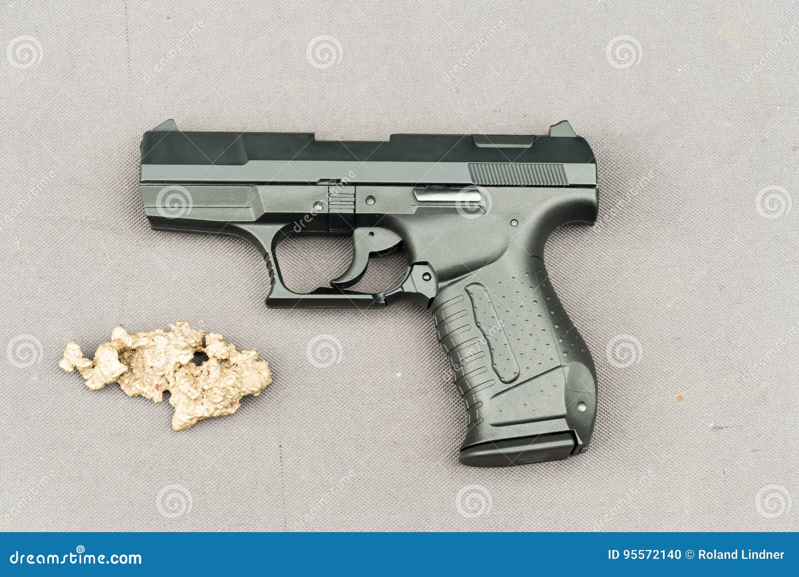 Pistol with gold nugget stock photo. Image of robbery - 95572140