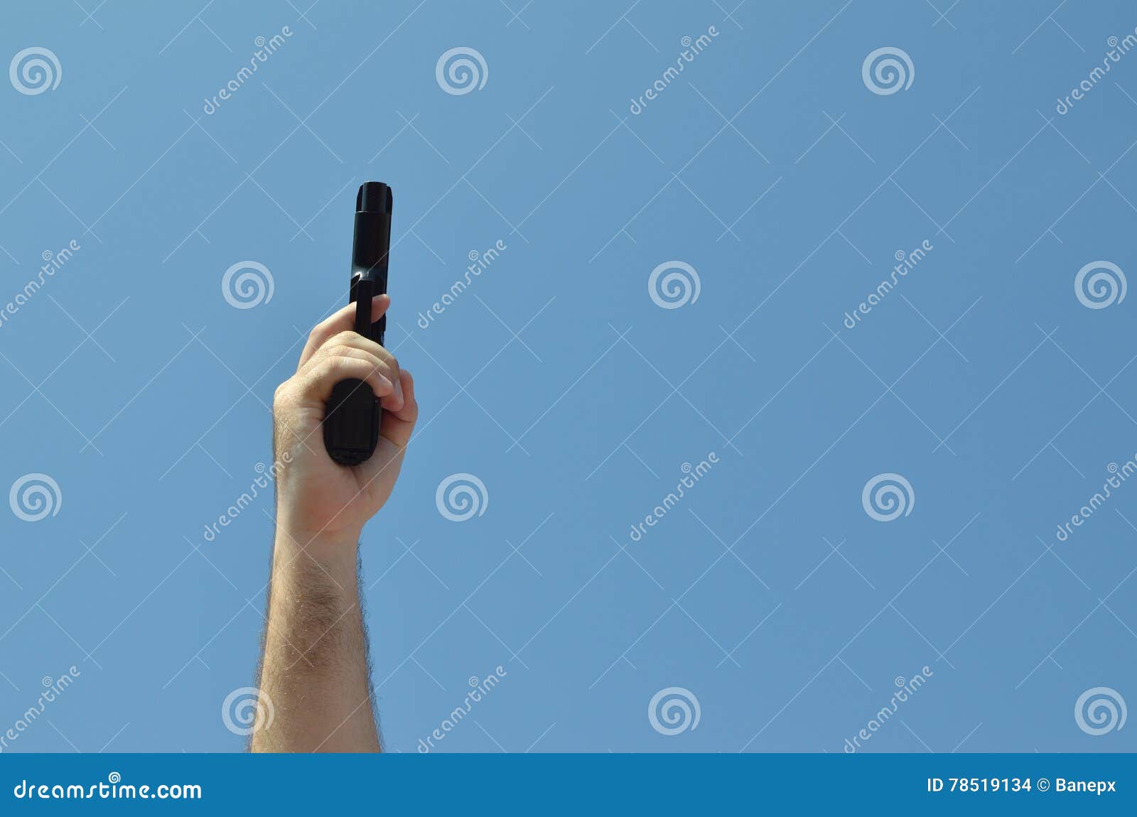 Pistol Pointed at Sky stock photo. Image of kill, hold - 78519134
