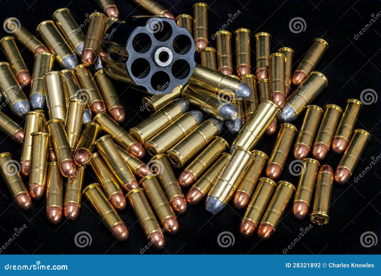 Pistol Revolver on a Pile of Bullets Stock Photo - Image of cartridge ...