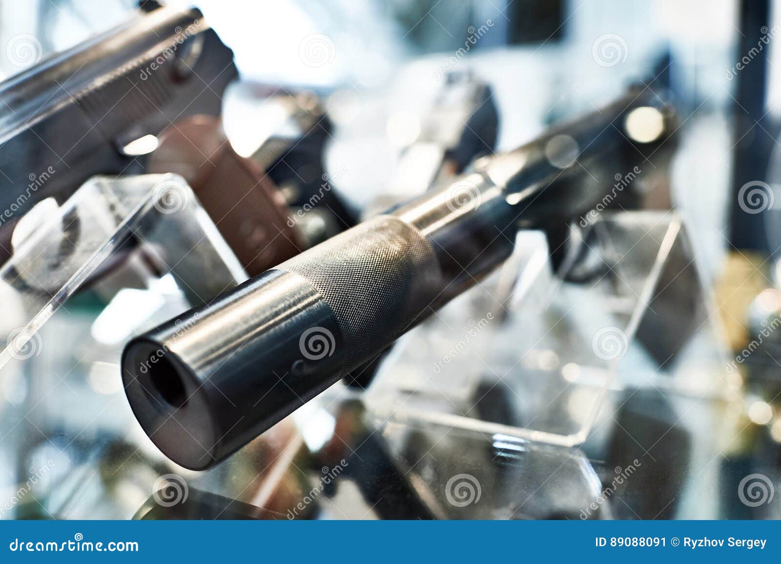 Pistol with Silencer in Shop Window Stock Image - Image of pistol, auto ...
