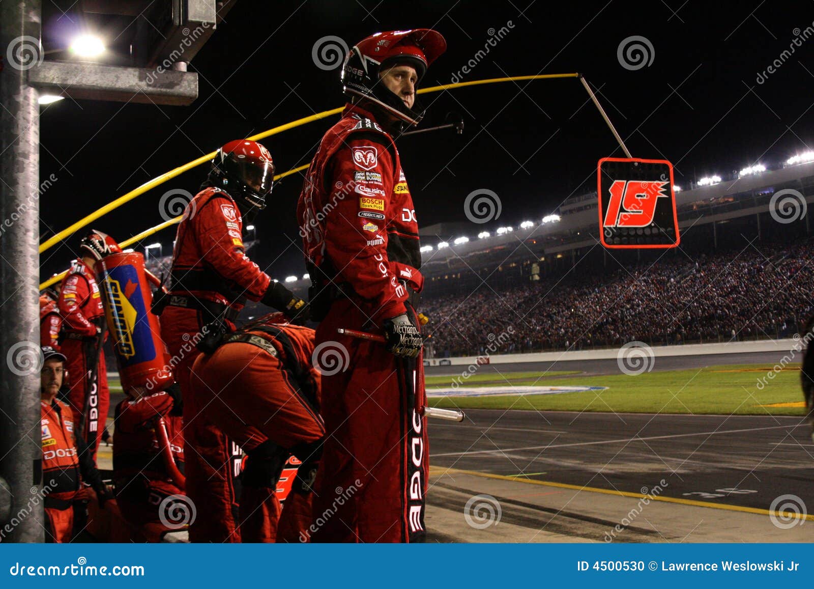 Pit Crew on the Wall editorial image. Image of garage - 4500530