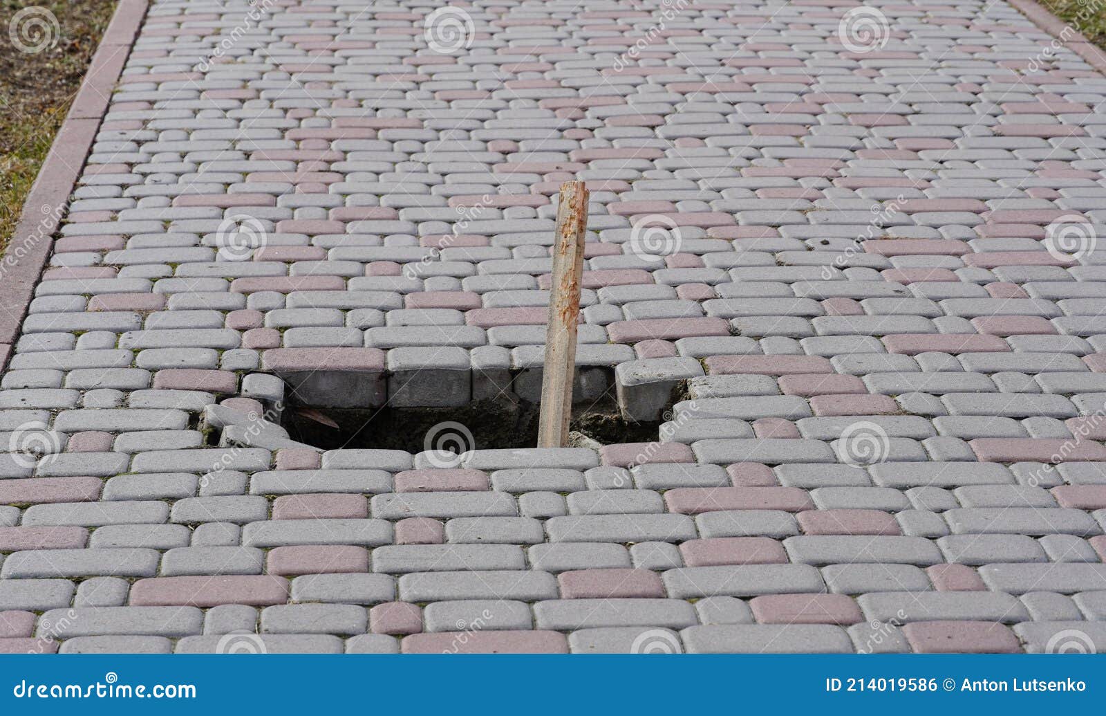 A Pit with Destroyed Paving Slabs a Street Stock Photo - Image of city ...