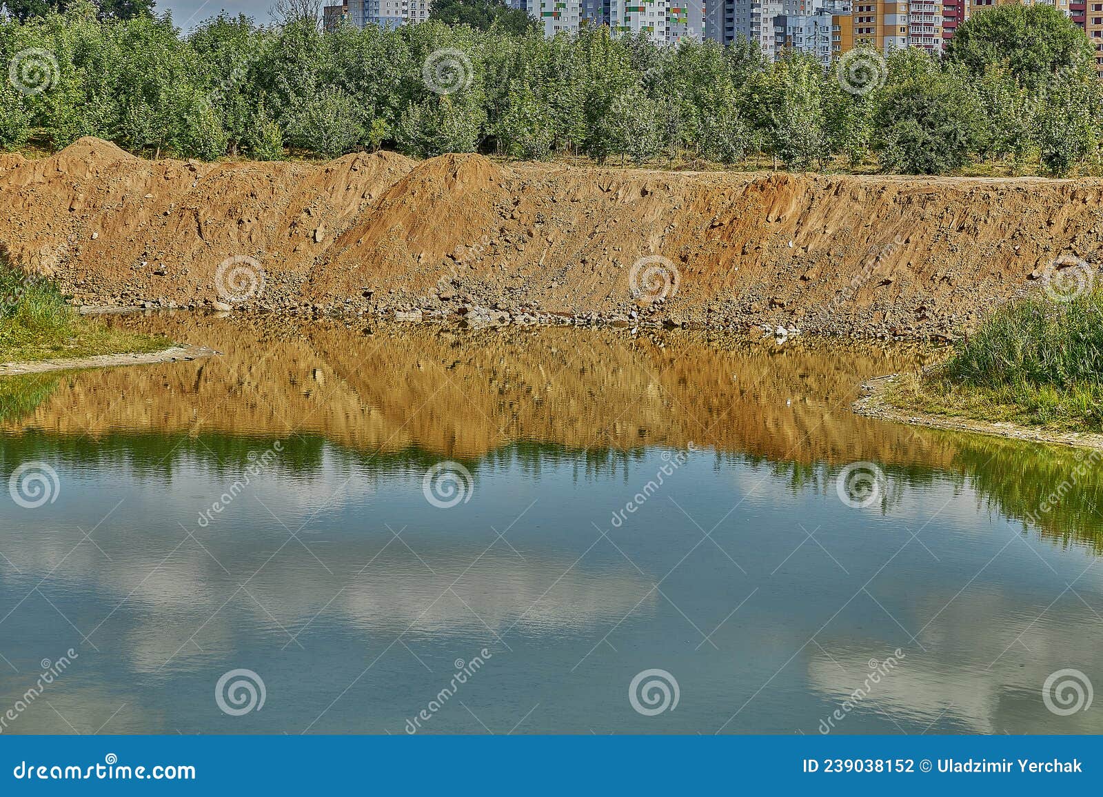 A Pit Filled with Water Near the City Stock Photo - Image of ...