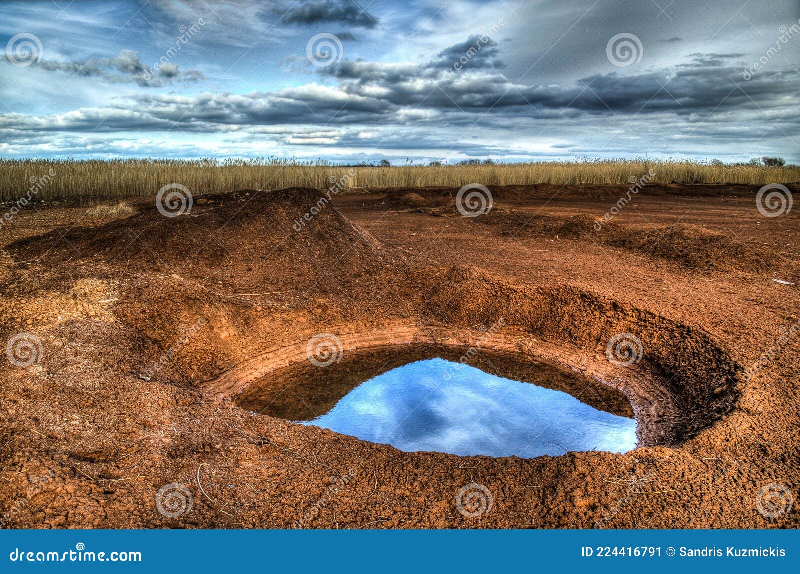A Pit with Water and a Reflection of Sky in it Stock Image - Image of ...