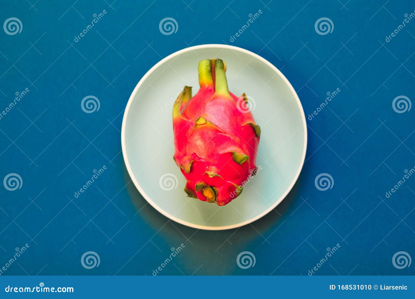Pitaya. the Close-up of Ripe Dragon Fruit on Plate on Blue Background ...