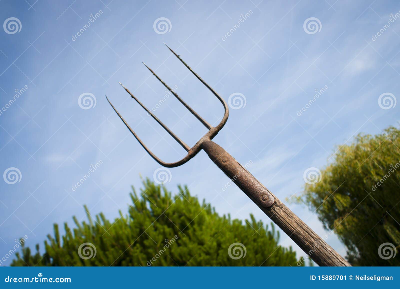 Pitch fork held aloft stock image. Image of pitch, devil - 15889701