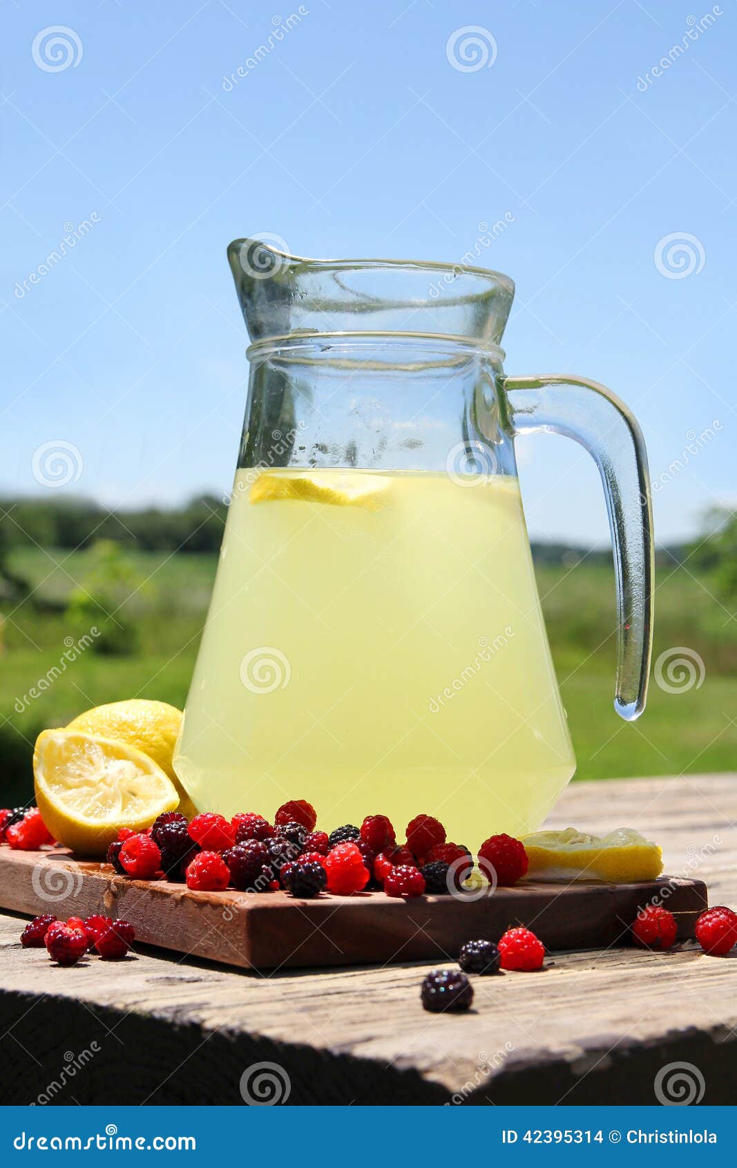 Pitcher of Ice Cold Lemonade and Fruit Outside in Summer Stock Photo ...