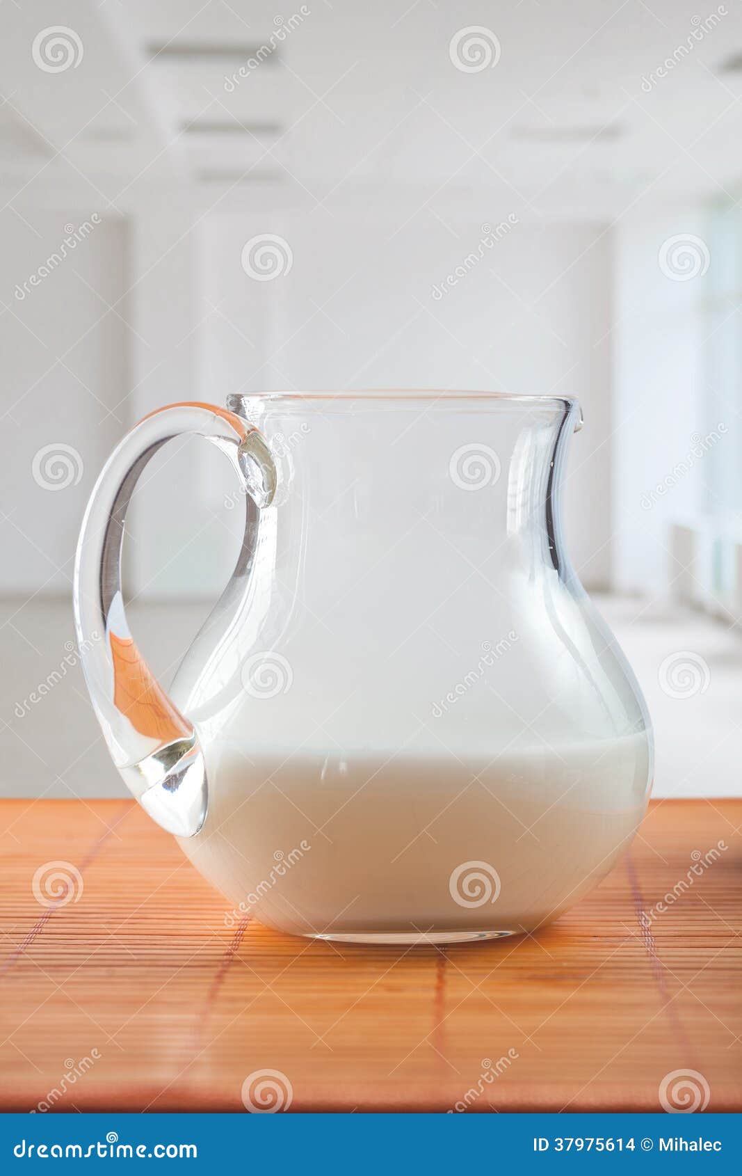 Pitcher with milk on table stock photo. Image of glassware - 37975614