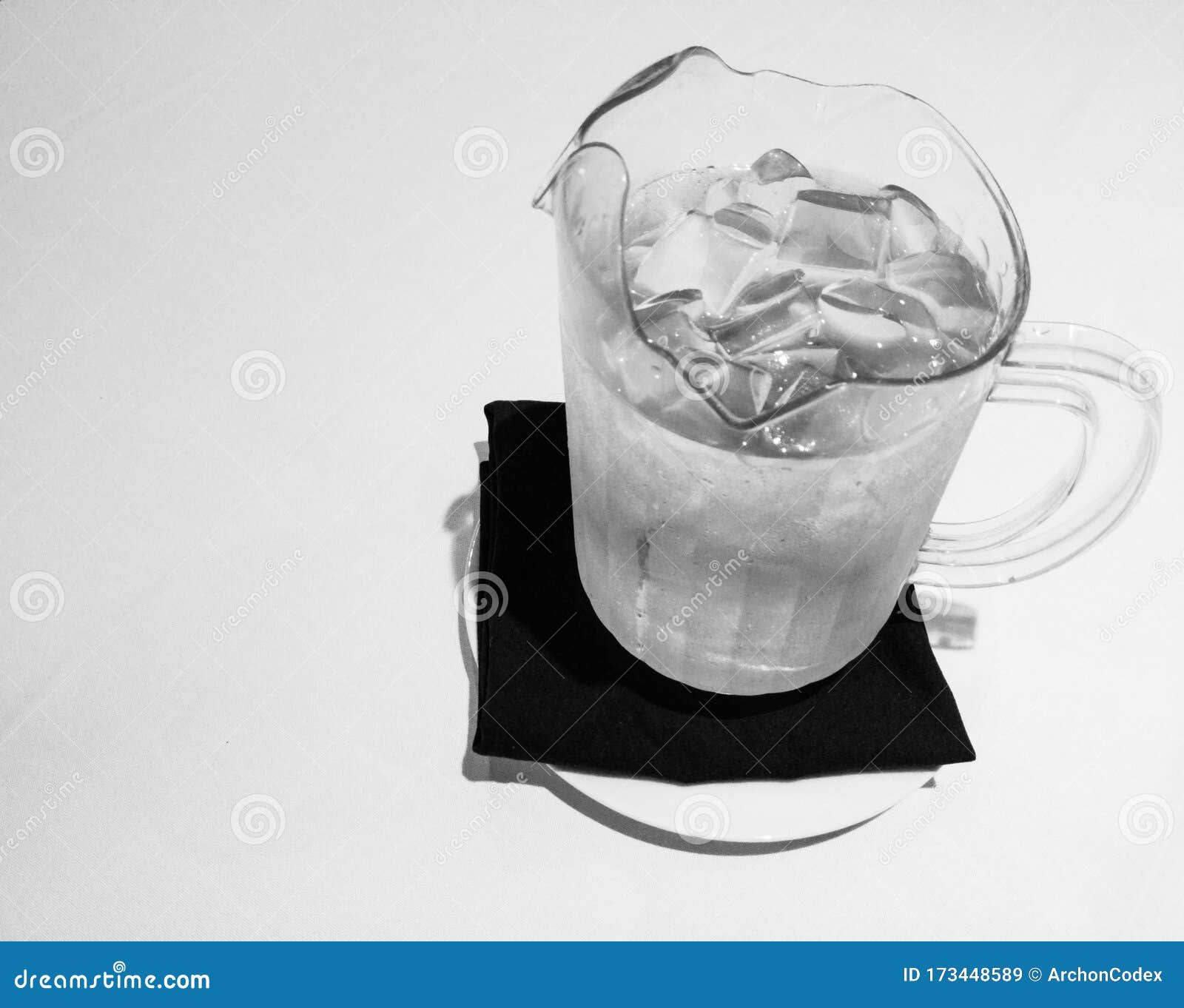Pitcher with Water and Ice on White Table Stock Image - Image of plate ...