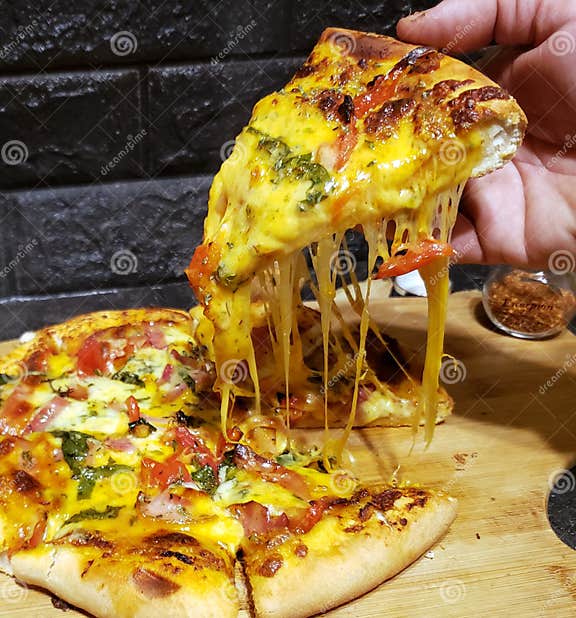 Pizza Cheese Pull is the Best Stock Photo - Image of meal, curry: 221981348