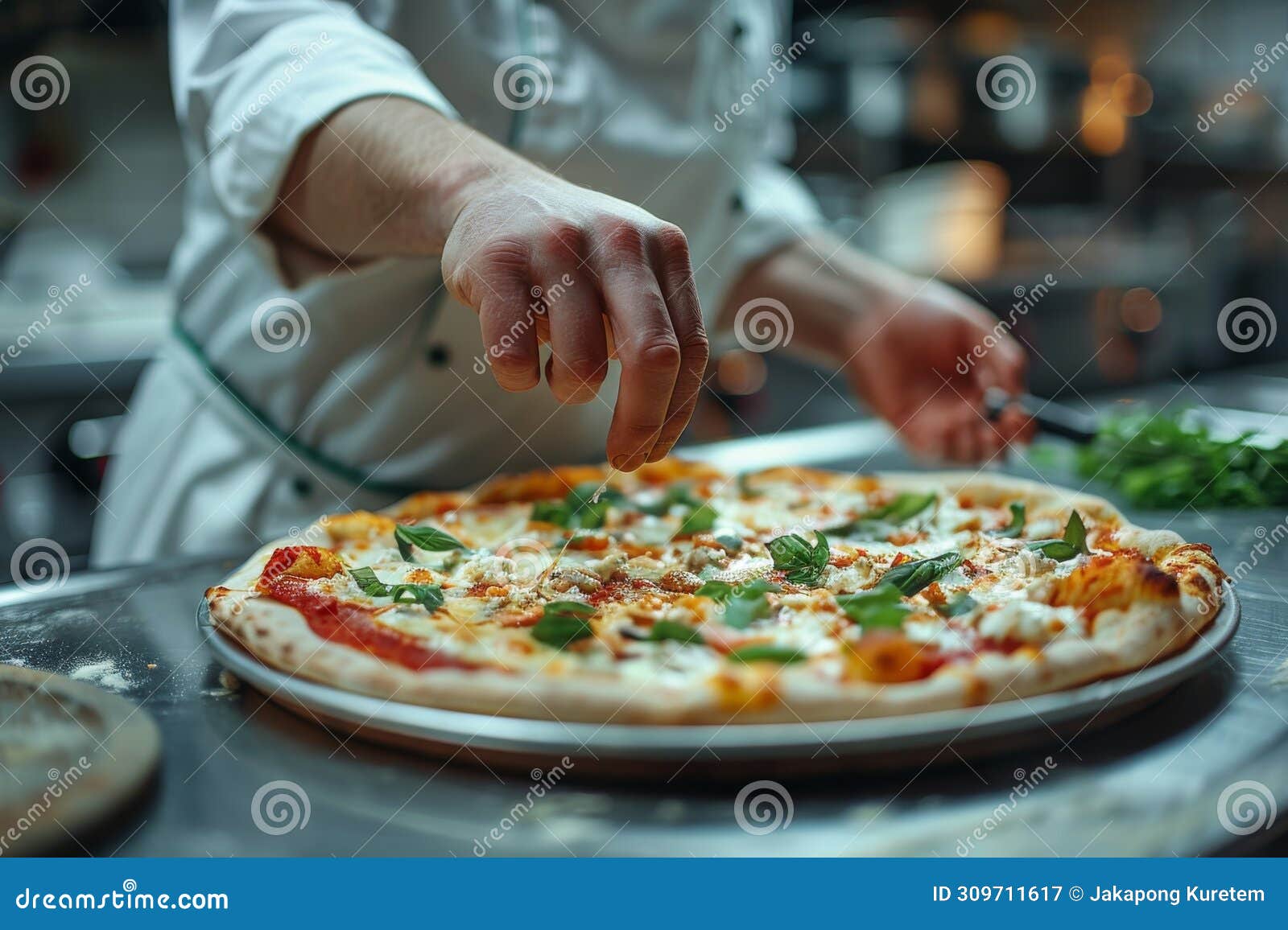 Pizza Chef Finishing the Preparing of in Pizzeria Restaurant Kitchen ...