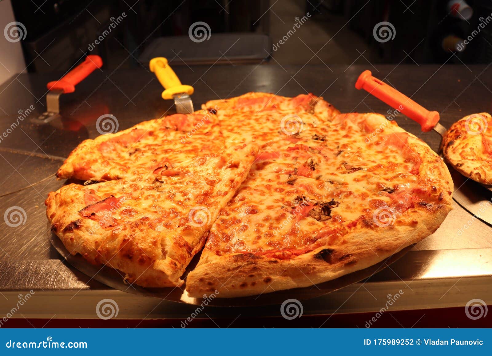 Pizza cut in six slices stock photo. Image of cuisine - 175989252