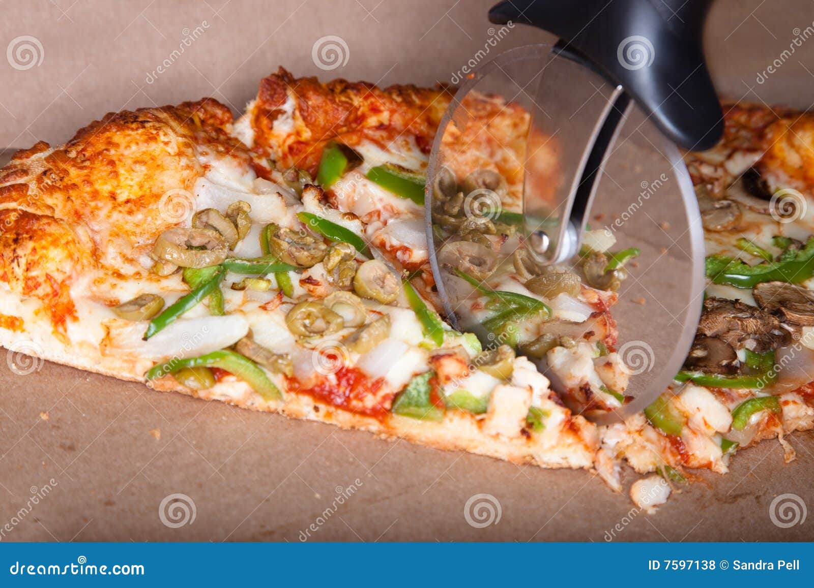 Pizza Cutter Slicing through a Pizza. Stock Photo - Image of dough ...