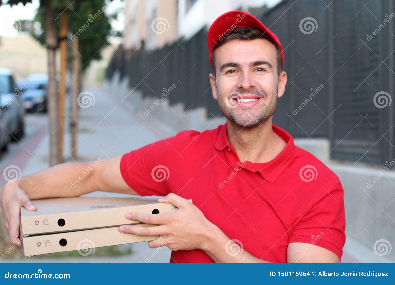 Pizza Delivery Guy Smiling Outdoors Stock Photo - Image of attractive ...