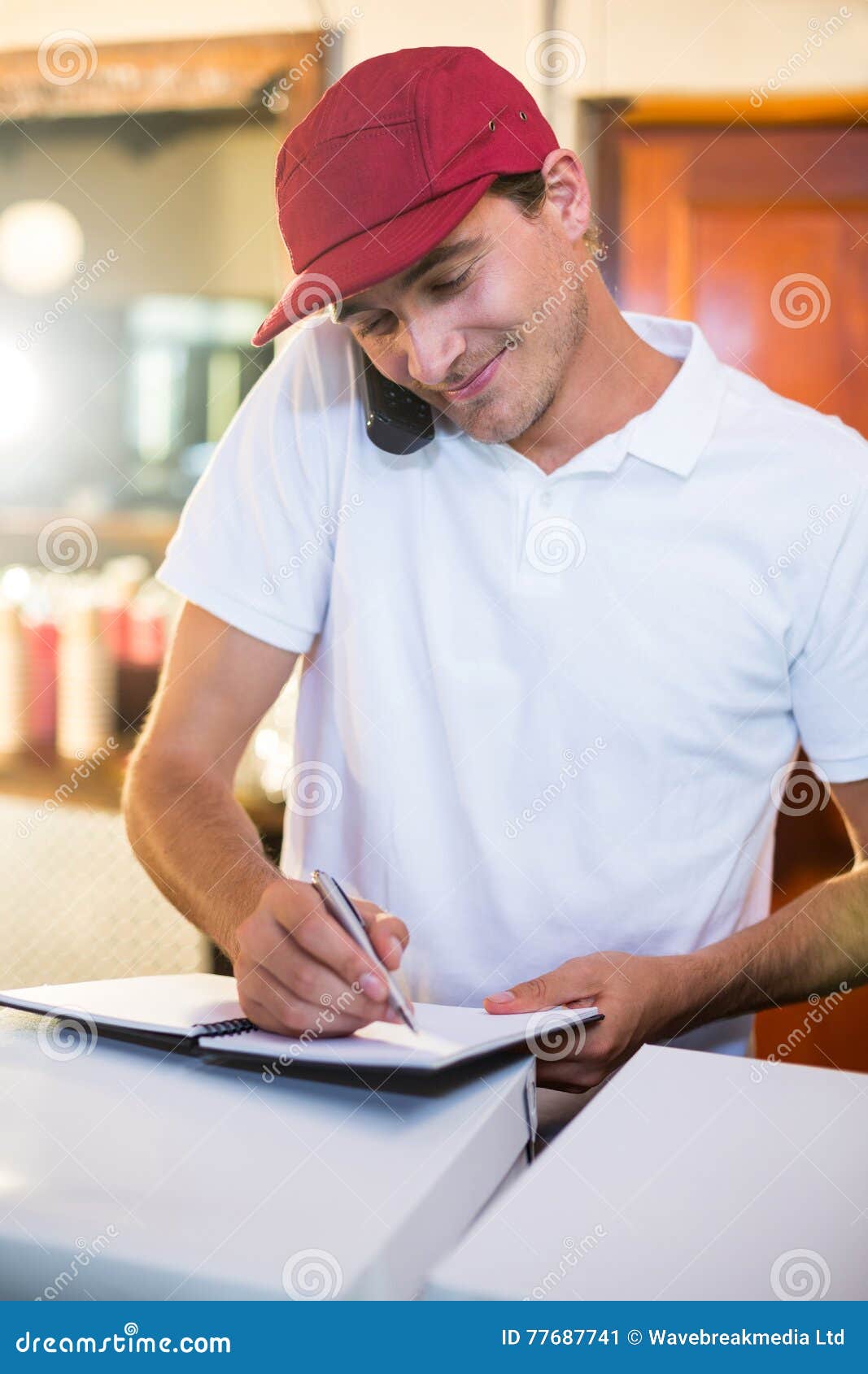 Pizza Delivery Man Taking an Order Over the Phone Stock Image - Image ...