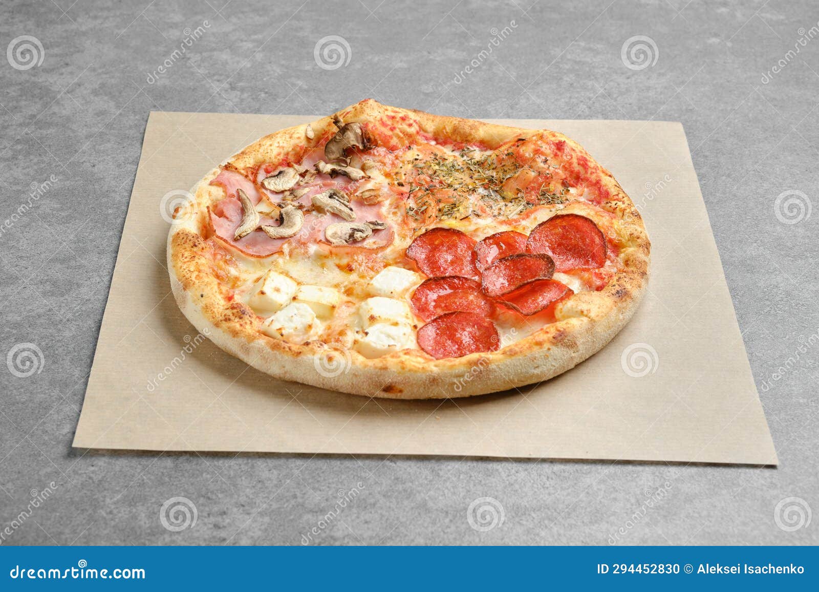 Pizza Four Seasons on Parchment Paper Stock Photo - Image of menu ...