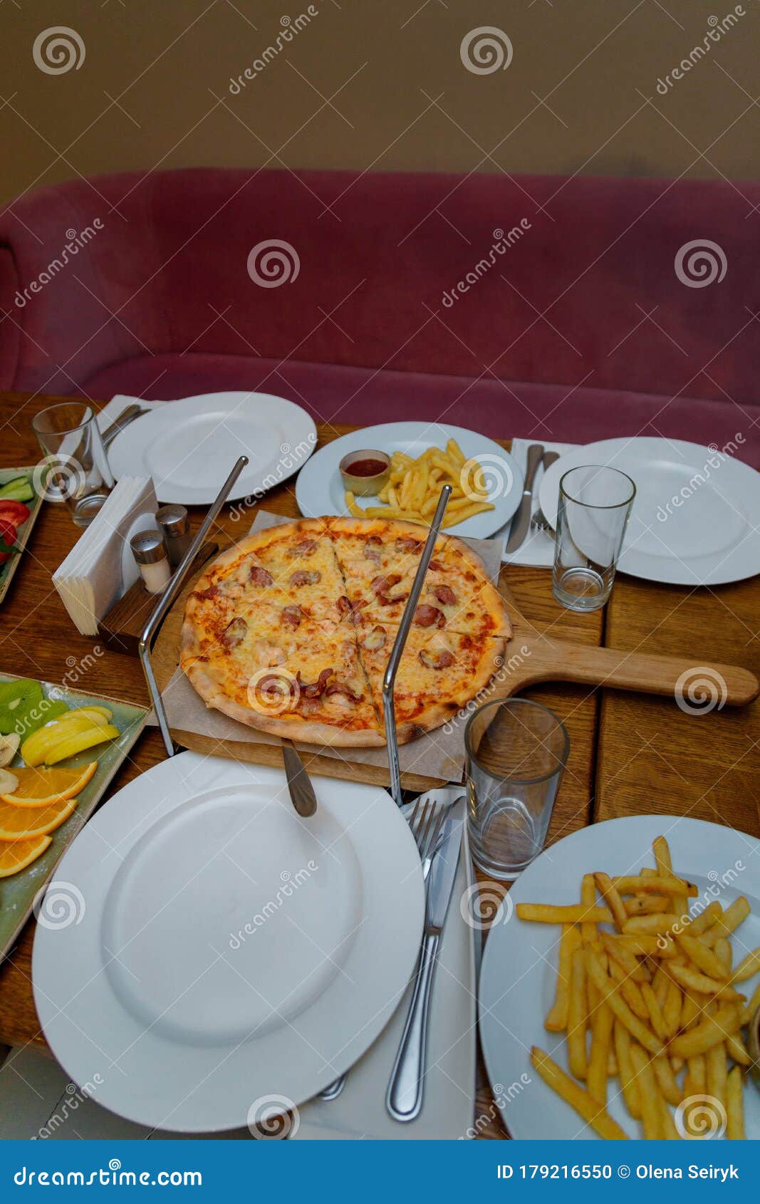Pizza and Fried Potatoes on White Plates. Festive Table Setting Stock ...