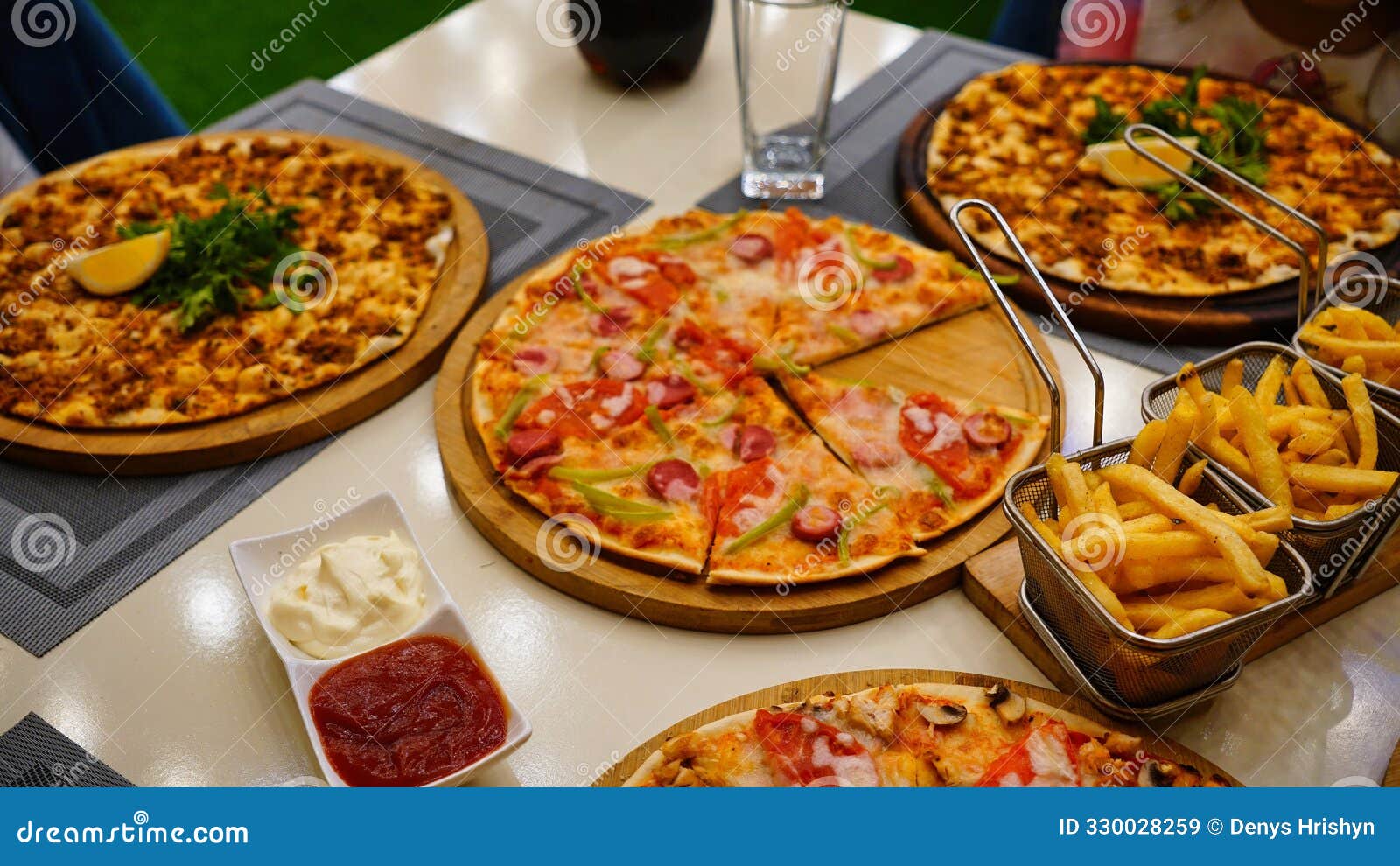 Pizza and Fries on a Table stock image. Image of cheese - 330028259