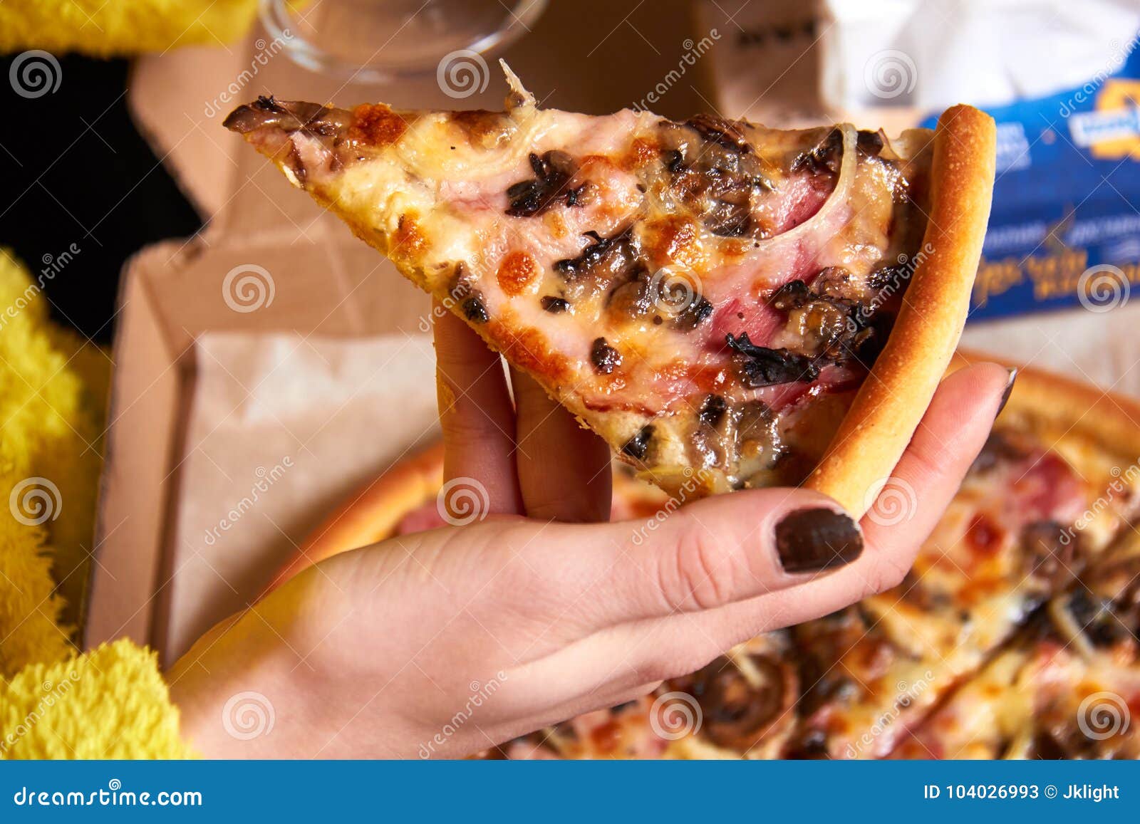 Pizza in hand. stock image. Image of pastry, food, delicious - 104026993