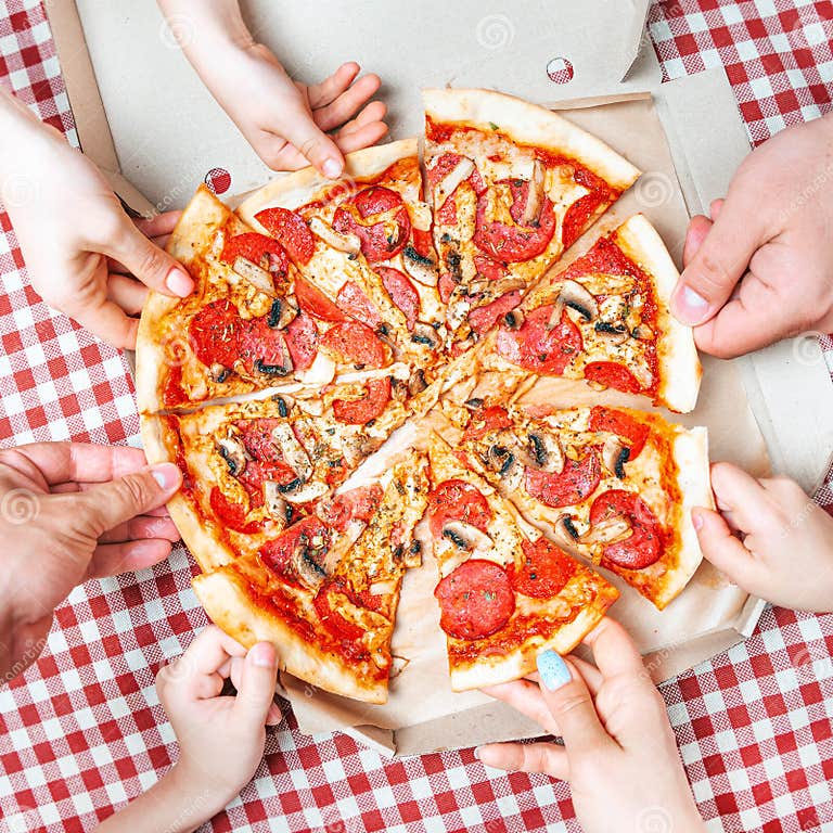 Pizza Hands. Several Hands Take Pizza at the Same Time, View Above ...