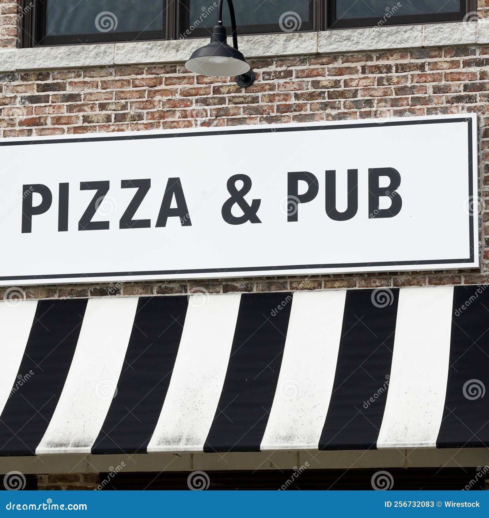 Pizza and Hub Sign on the Building Stock Image - Image of icon, sign ...