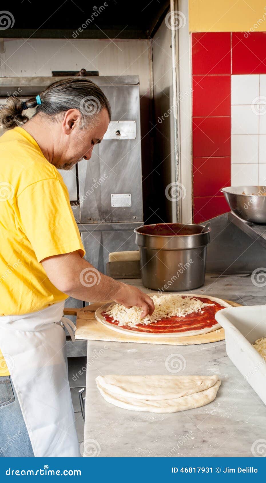 Pizza Maker Puts Mozzarella Cheese on a Pizza Stock Image - Image of ...