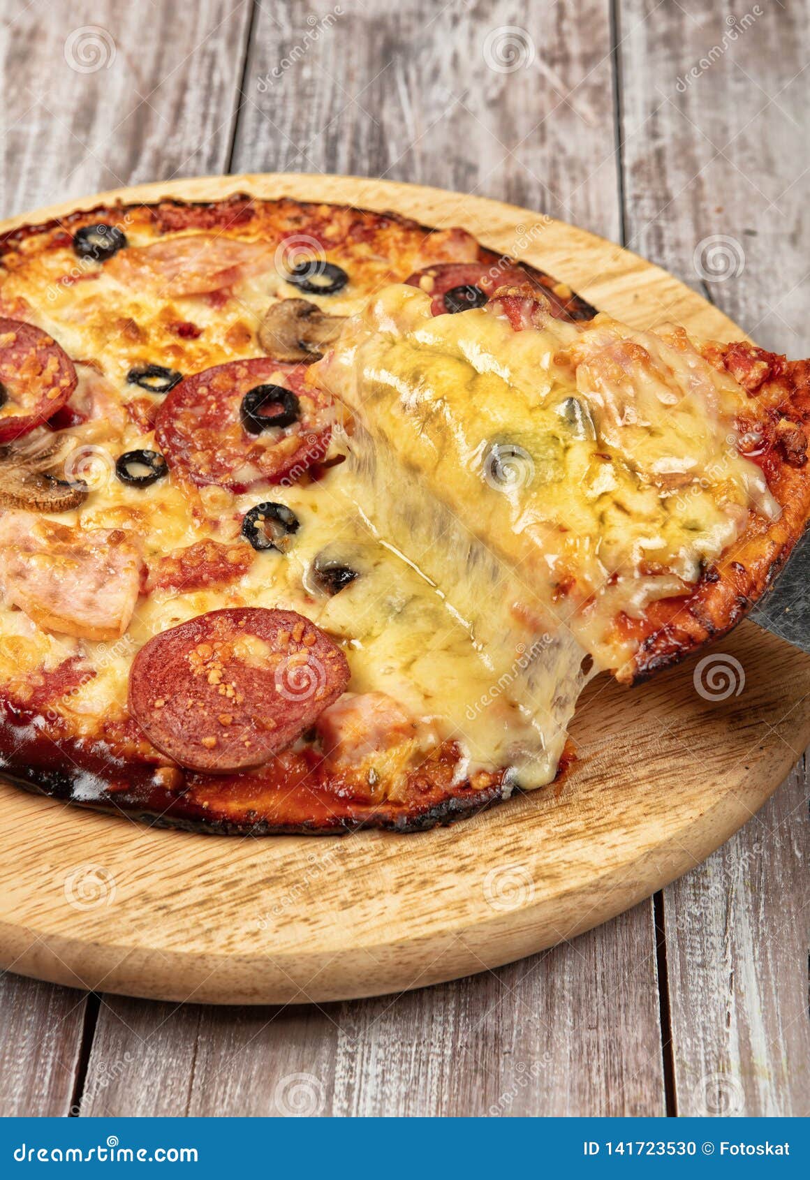 Pizza and a piece stock photo. Image of pizza, baked - 141723530