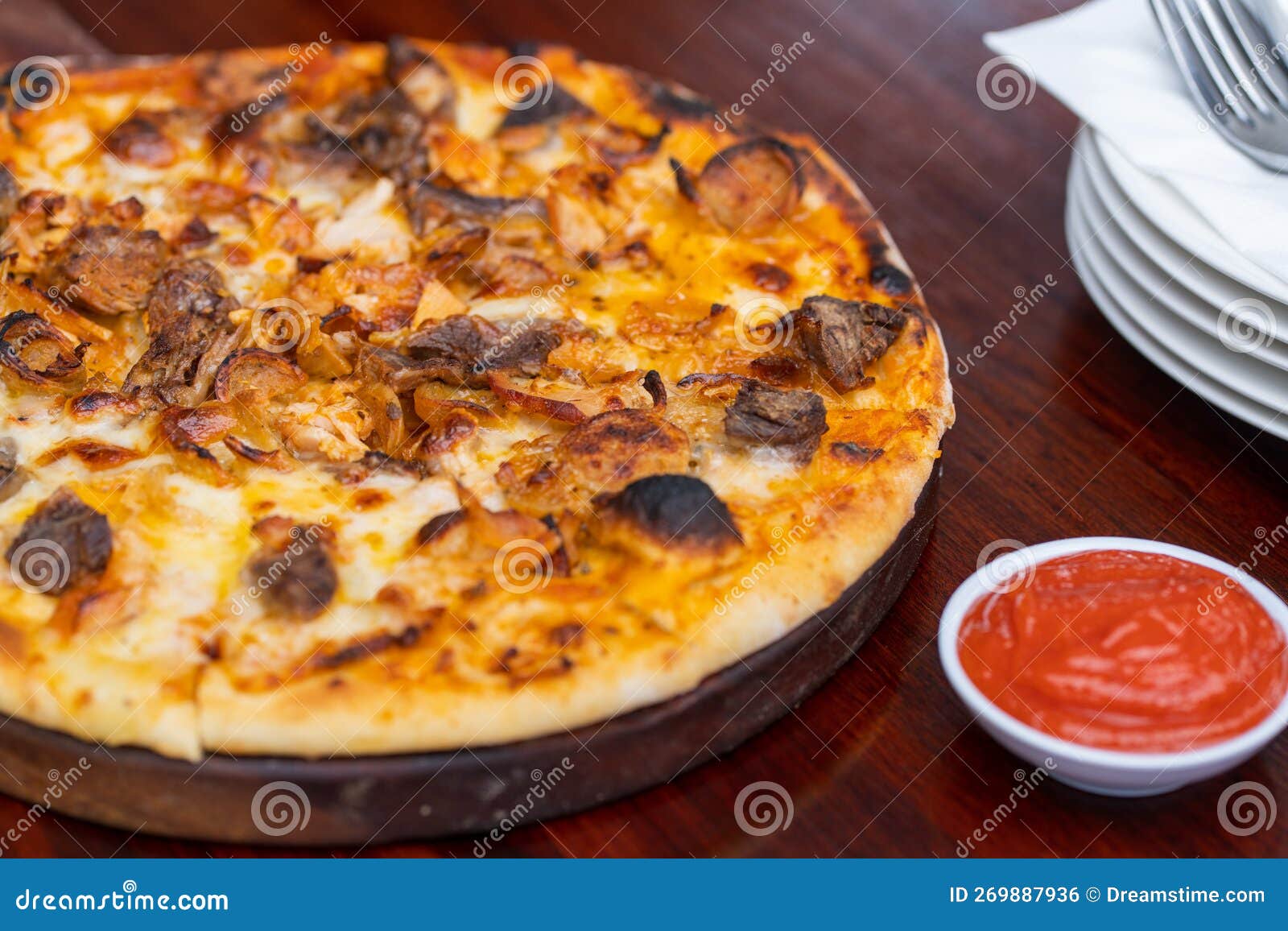 The Pizza Served on the Table is a Visual Feast that Whets the Appetite ...
