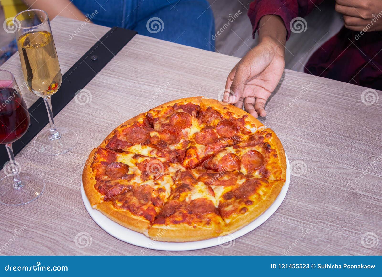 A pizza on a table stock image. Image of gourmet, pizz - 131455523
