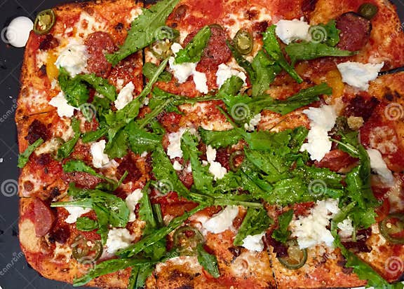 A pizza with toppings stock image. Image of square, toppings - 56691779